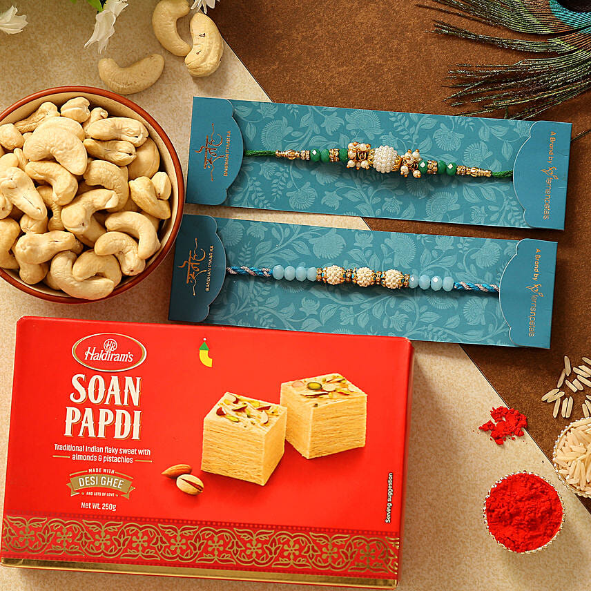 Online Set Of 2 Pearl Designer Rakhis & Soan Papdi Hamper Gift Delivery ...